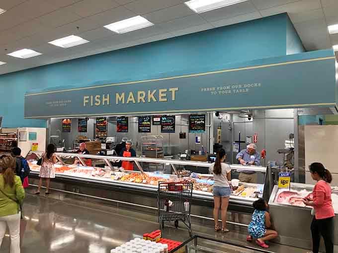 This fish counter stretches longer than your last family reunion and smells infinitely better, which is really saying something.