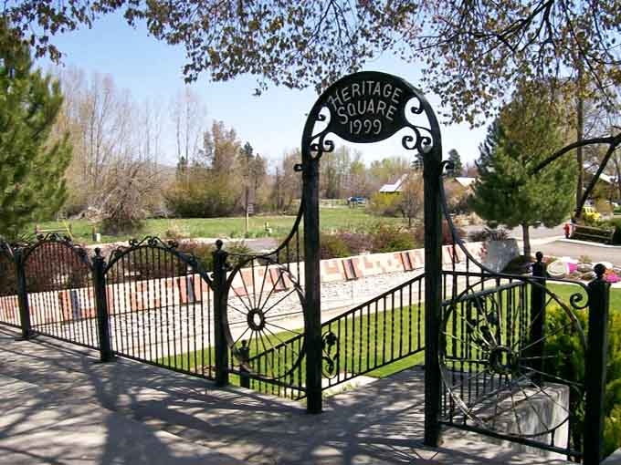 Heritage Square's ornate ironwork gateway welcomes you to a community that honors its past with genuine pride.