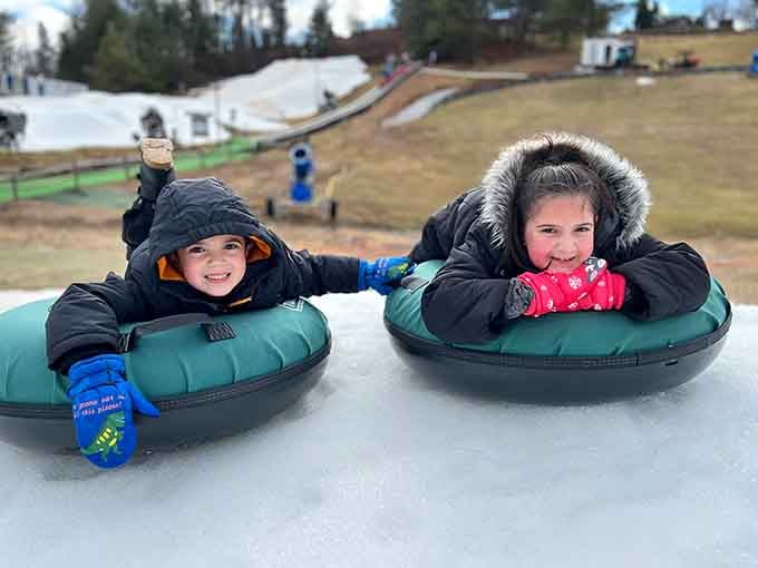 Pure joy captured in two smiles and a pair of tubes ready to conquer gravity together.
