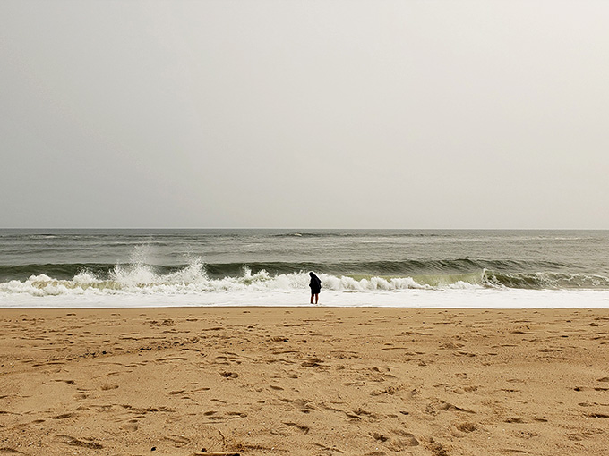Standing solo against Atlantic waves, contemplating life's mysteries or just wondering if you left the stove on.
