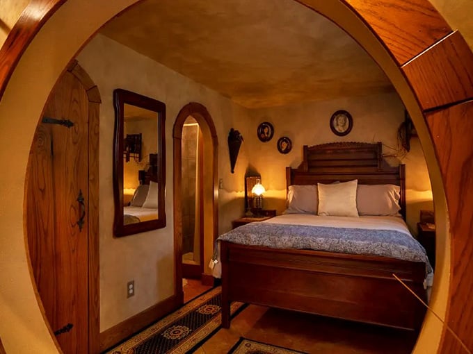 Curved wooden ceilings and soft lighting make this bedroom cozier than any five-star hotel could manage.