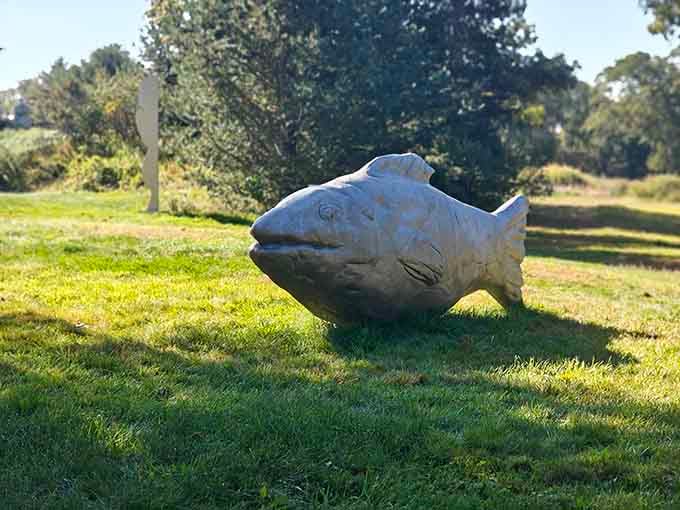 This stone fish proves that even landlocked sculptures can have serious aquatic attitude and style.