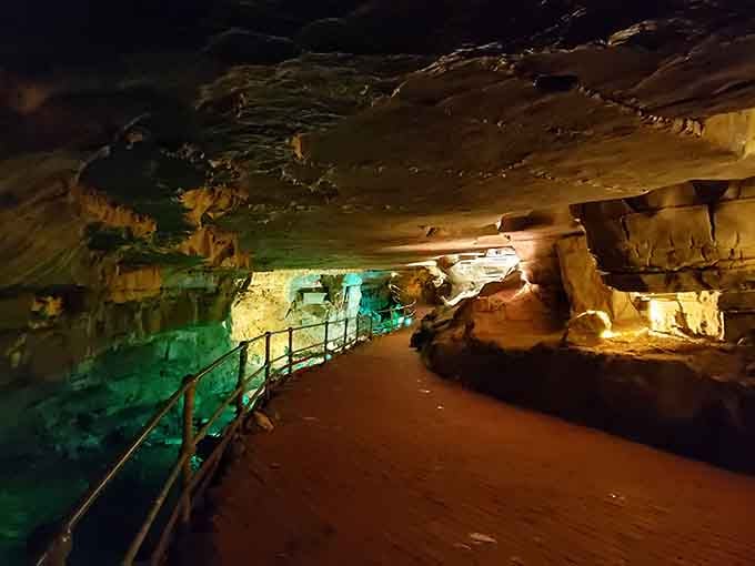 The brick pathway through ancient limestone proves that even caves appreciate a little modern infrastructure and sensible footwear.