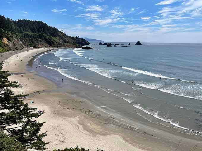 From this elevated perch, the rhythmic waves and scattered sea stacks create a view that makes every step down absolutely worthwhile.
