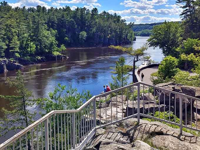Metal railings guide you safely along cliffs where the views make your camera work overtime.