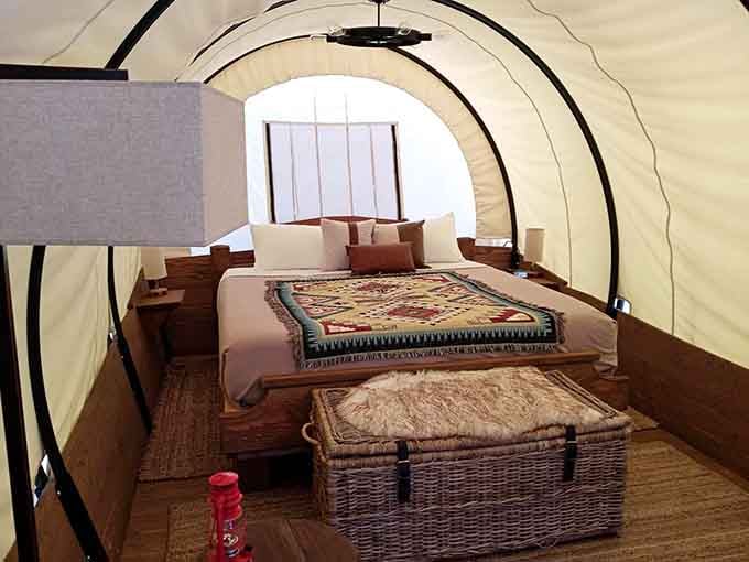 Inside your wagon, a real bed awaits, proving pioneers would've totally upgraded given the chance.