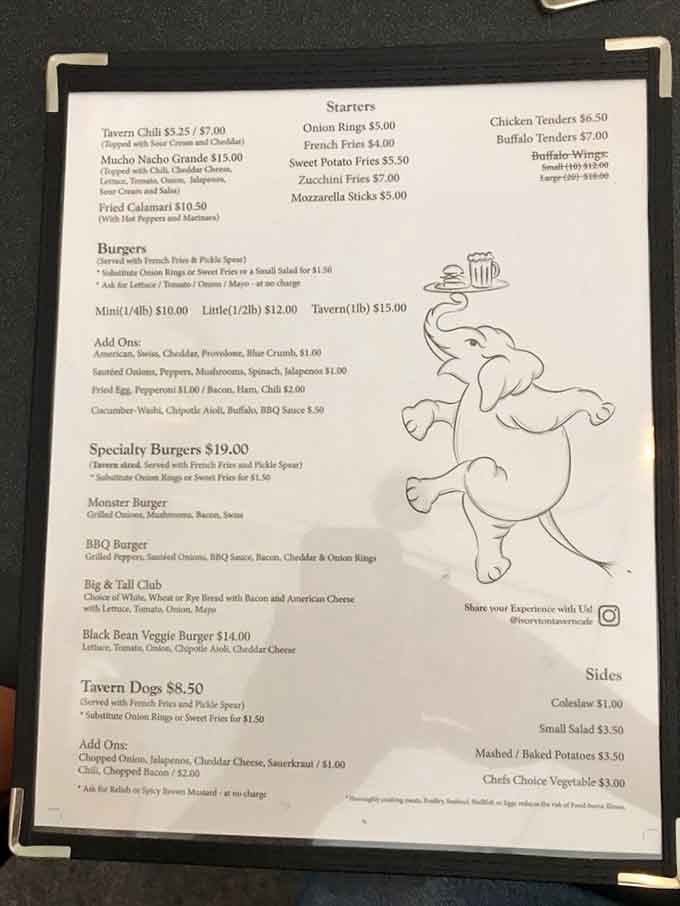 The menu features an adorable elephant mascot, which is fitting because you'll never forget these burgers once you try them.