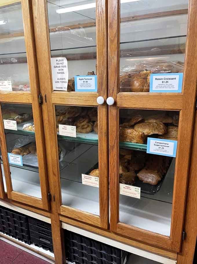 Wooden display cases packed with pastries so good, the tongs feel like a privilege to hold.