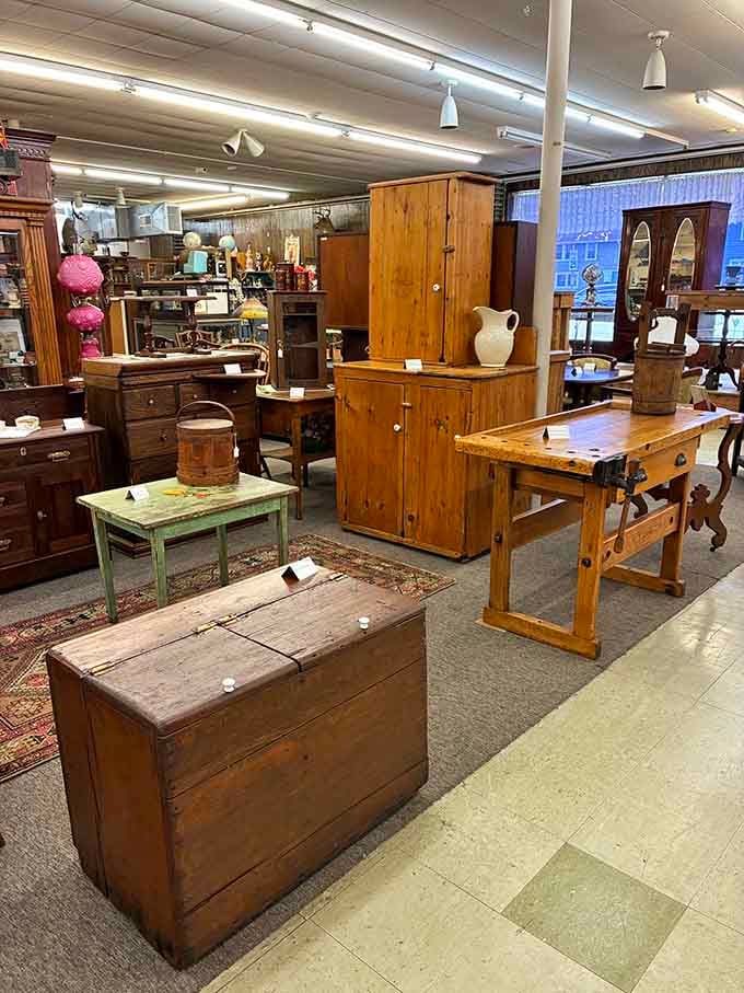 Solid wood furniture arranged like a showroom from 1952, when craftsmanship meant something built to outlast your grandchildren.