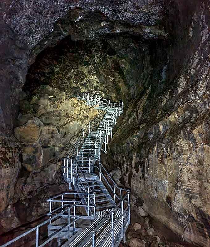 These metal stairs descend into geological history, leading you down into 80,000 years of volcanic storytelling.