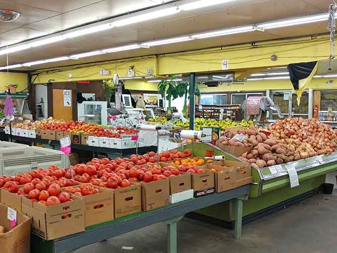 Yellow walls frame mountains of tomatoes and potatoes, turning grocery shopping into an actual visual feast.
