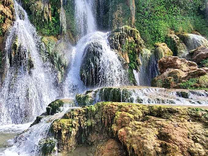 Watch the water dance over mineral deposits that took centuries to form, because geology has excellent patience.