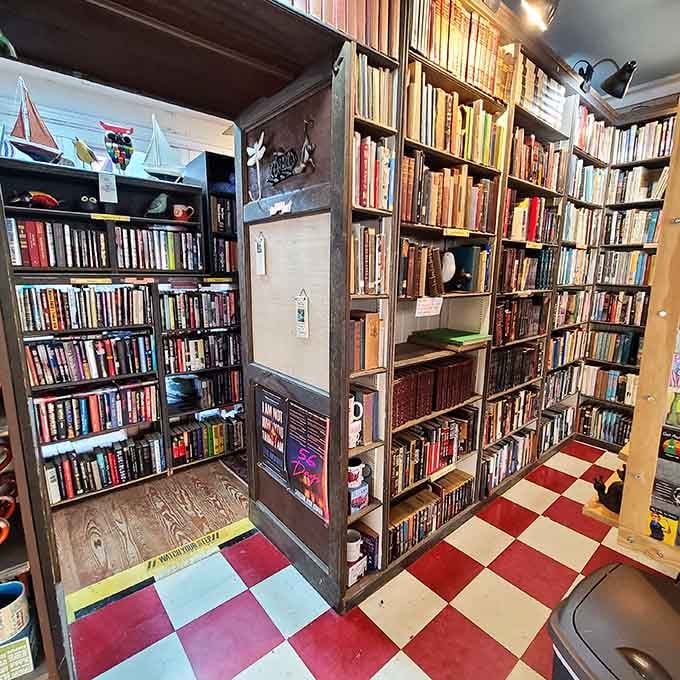 That bright red ladder isn't just functional, it's your ticket to literary treasures hiding on the highest shelves.