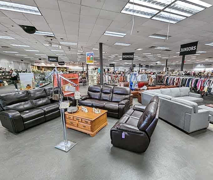 Leather recliners and couches arranged like a furniture showroom, except everything here costs practically nothing.