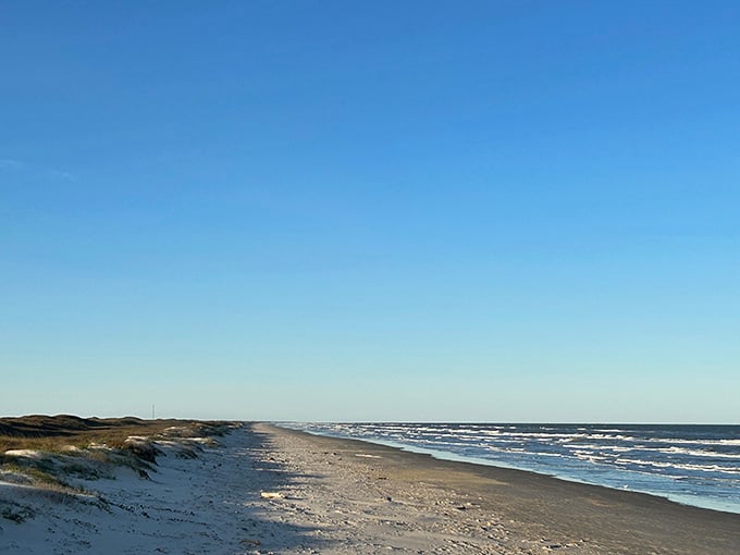 Miles of untouched sand stretching into forever, because sometimes less really is more in the best way possible.