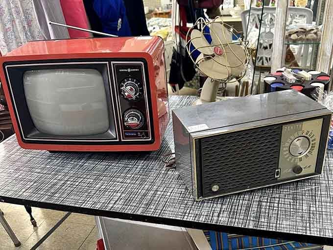 Remember when TVs had dials and radios were furniture? This booth remembers, and it's glorious.