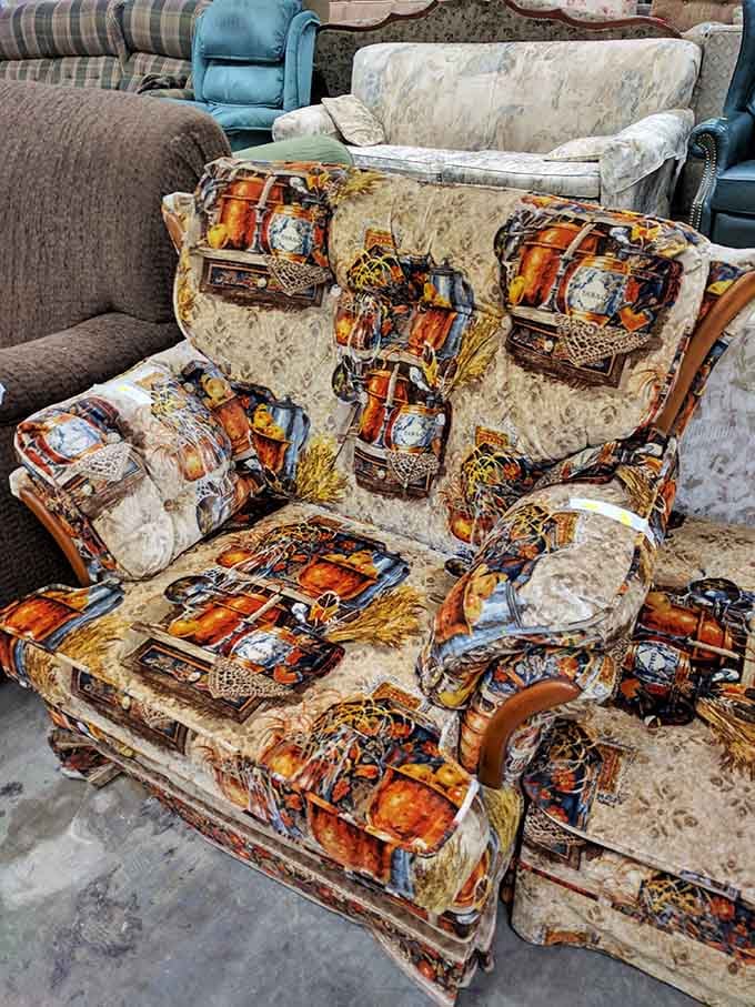 This armchair has seen some things, and honestly, that harvest-themed upholstery is kind of growing on me now.