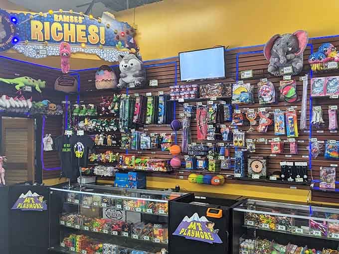 This prize counter holds more treasures than a pirate's chest, turning arcade tickets into the currency of childhood dreams and negotiations.