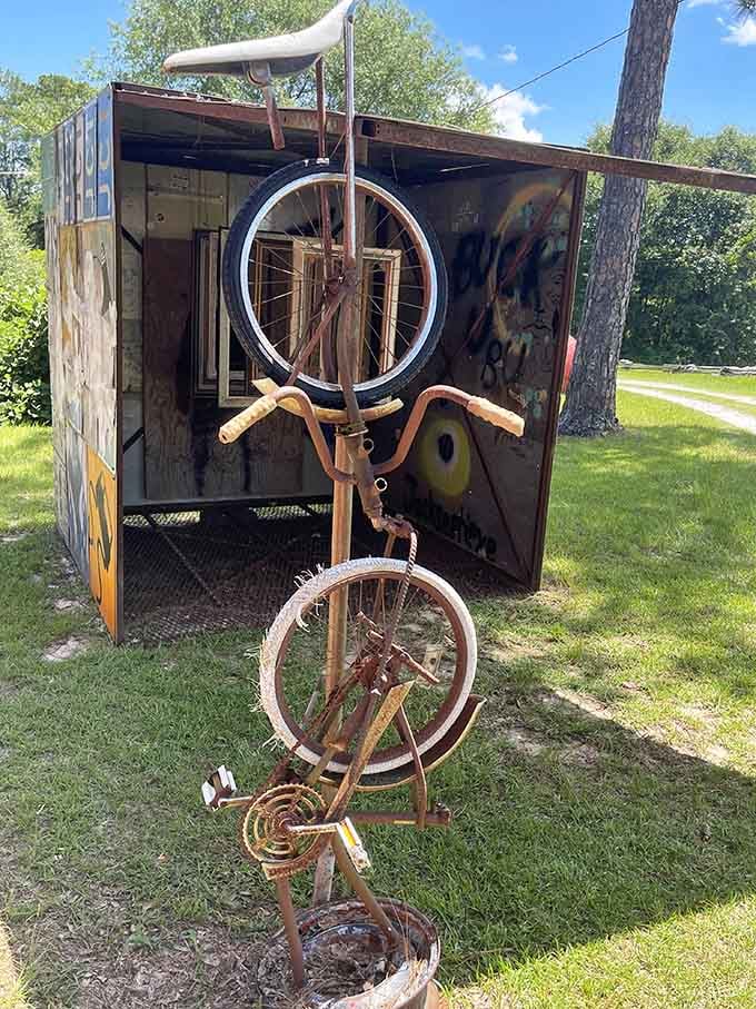Somebody looked at rusty bicycle parts and saw pure possibility, transforming forgotten wheels into whimsical roadside sculpture that stops traffic.