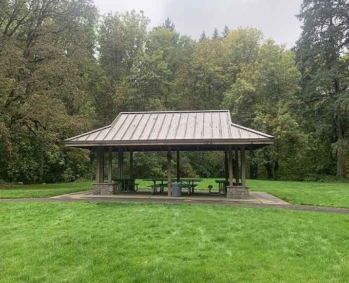 This covered picnic shelter stands ready for your lunch plans, rain or shine, because Oregon weather keeps everyone guessing.