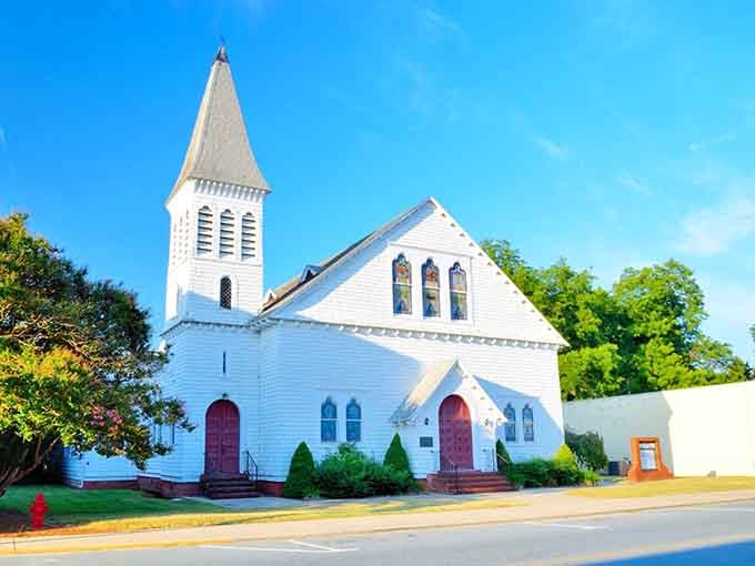 This pristine white church has been anchoring the community longer than your family's been having the same arguments.