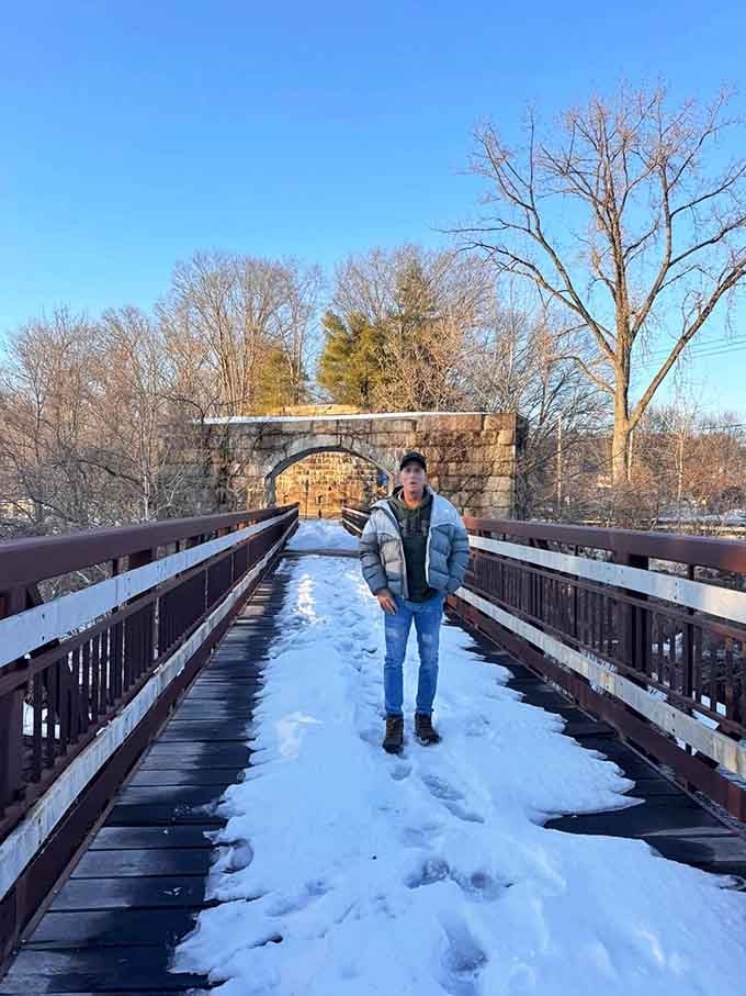 Nothing says "I conquered nature" quite like a snowy bridge photo, even if downtown's just behind you.