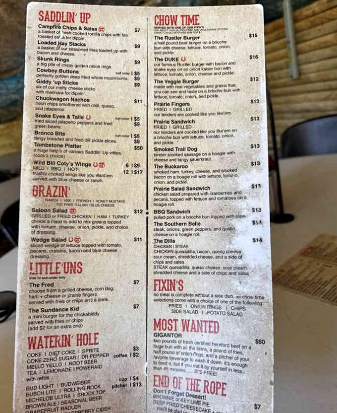 When menu items include "Snake Eyes & Tails" and "The Duke," you know you're in for cowboy-sized portions with personality.