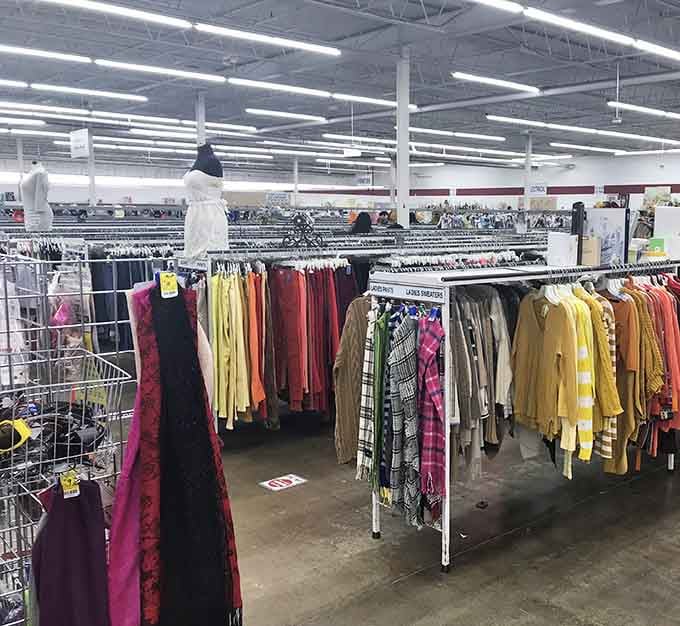 Rows stretching into the distance like a rainbow of second chances, each hanger holding someone's future favorite outfit.