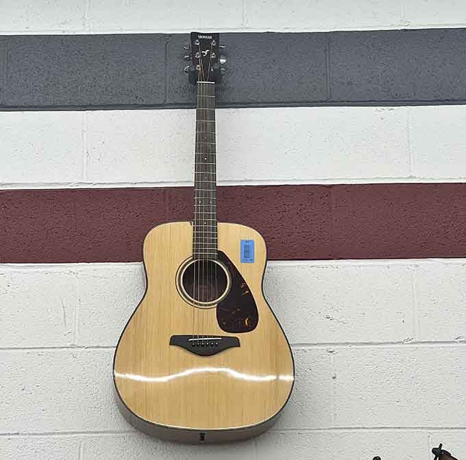 This acoustic beauty waits patiently for fingers that'll bring it back to life, proving music never truly retires.