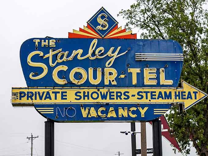 The Stanley Scour-Tel sign advertises private showers and steam heat, luxuries that once meant everything to road-weary travelers.