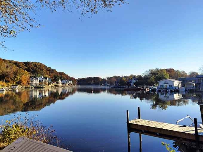 The Kalamazoo River reflects autumn's glory like nature's showing off, and honestly, we're not complaining.
