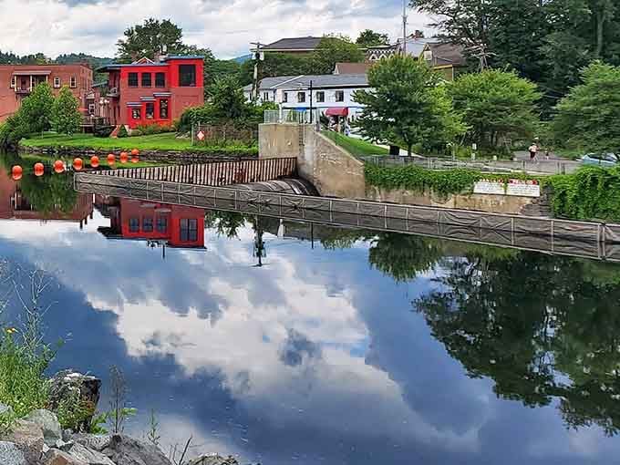 When the river's so calm it doubles as a mirror, reflecting the village like nature's own postcard.