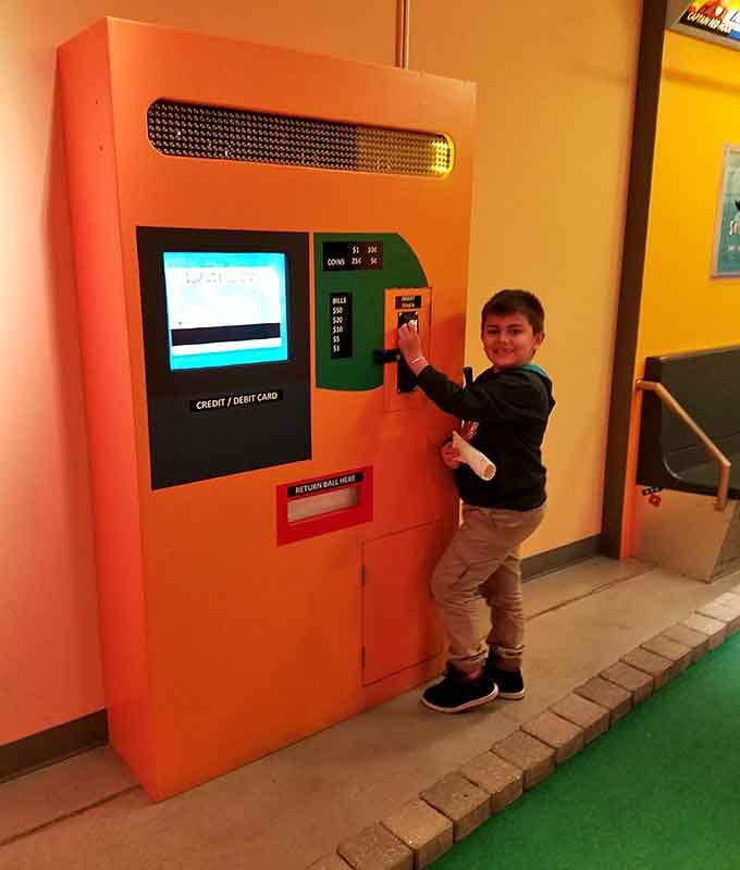 Even the ticket kiosk gets the retro treatment with that gorgeous orange glow and old-school charm throughout.