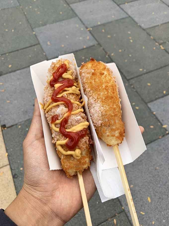 Two golden beauties ready for their close-up: one with the classic sugar-dusted coating, the other showing off those crispy potato cubes.