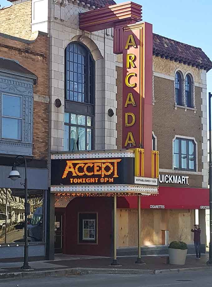 The Arcada Theatre's marquee glows with the kind of vintage charm that makes smartphones feel embarrassed.