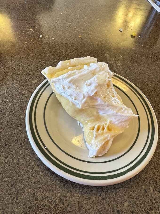 That towering slice of peanut butter pie isn't messing around, delivering creamy nostalgia with every magnificent forkful.