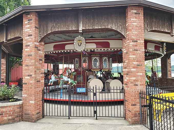 This beautifully maintained carousel sits protected under brick columns, spinning dreams since your grandparents were young.