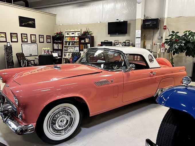 That coral-pink convertible is giving serious "American Graffiti" vibes, and we're absolutely here for it.