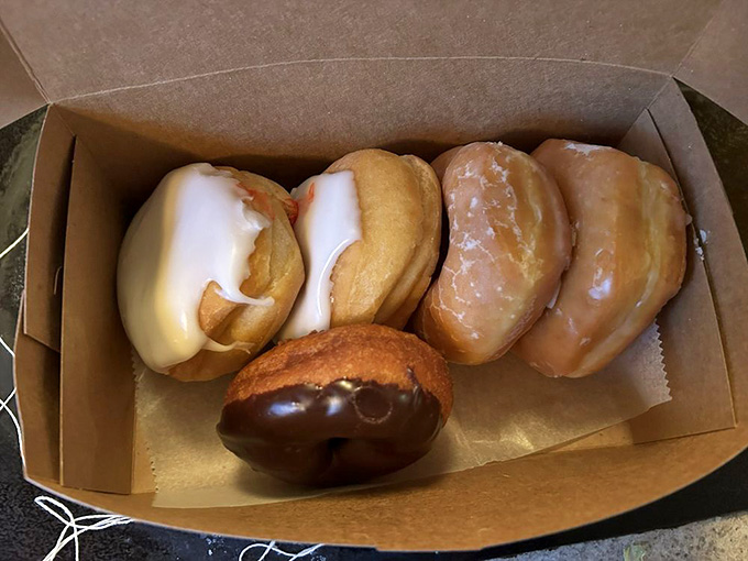 A box of donuts so beautiful it almost seems wrong to eat them. Almost being the key word here.