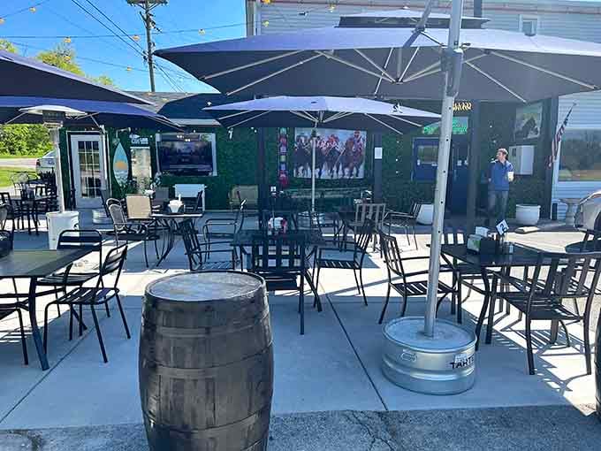 Those blue umbrellas and bourbon barrels signal good times ahead at this inviting outdoor gathering spot.