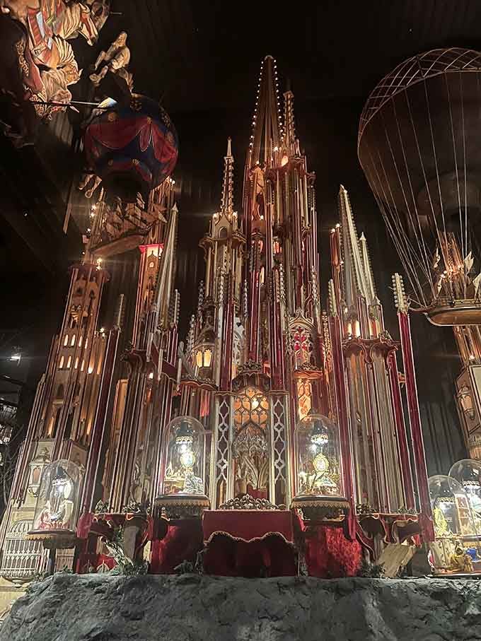 Gothic spires reach toward the ceiling like a miniature cathedral designed by someone who never heard the word "enough."