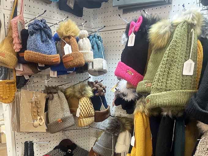 Winter hats with fuzzy pom-poms: because Michigan weather demands both warmth and a sense of playful defiance.