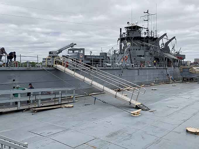 Standing where sailors once scanned horizons for enemy aircraft makes your daily commute feel remarkably less dramatic.