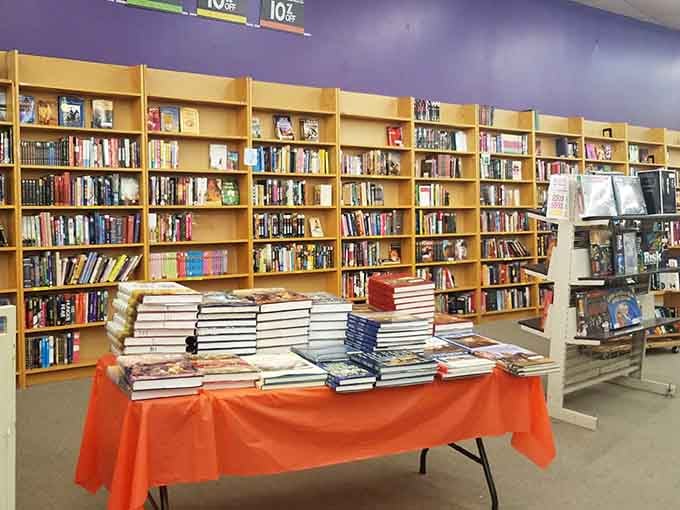 Rows of blonde wood shelving stretch endlessly, each one packed with adventures waiting to find their next reader.