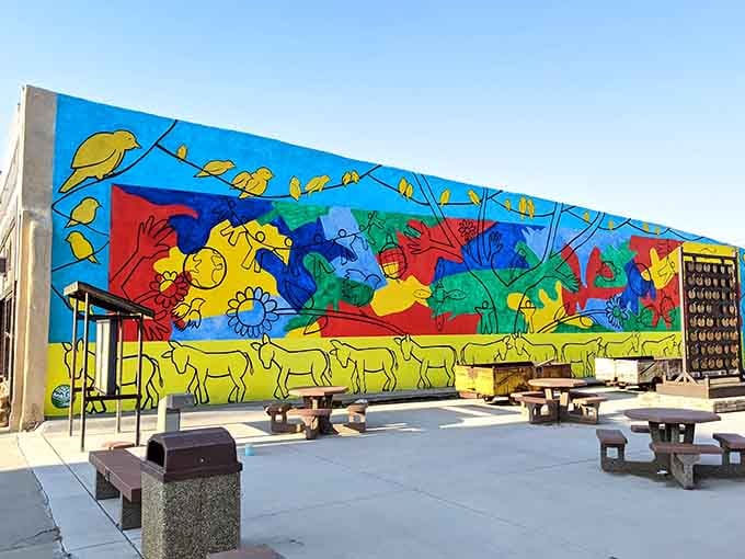 This vibrant mural brings serious color therapy to downtown, proving art belongs everywhere, not just galleries.