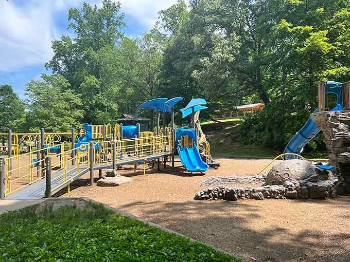Blue slides twist through this prehistoric paradise where imagination runs wild and screen time becomes ancient history.