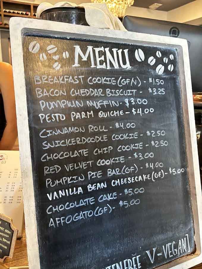The chalkboard menu proves that choosing between pesto parm quiche and chocolate cake is life's sweetest dilemma.