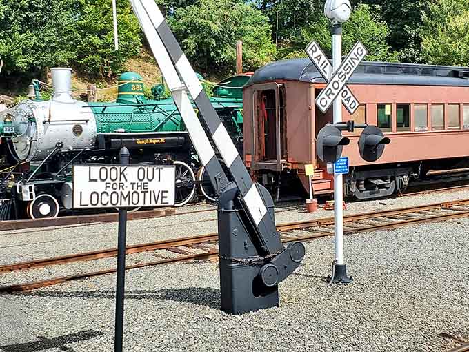 That railroad crossing sign means business, reminding visitors that real trains still rule these historic tracks today.