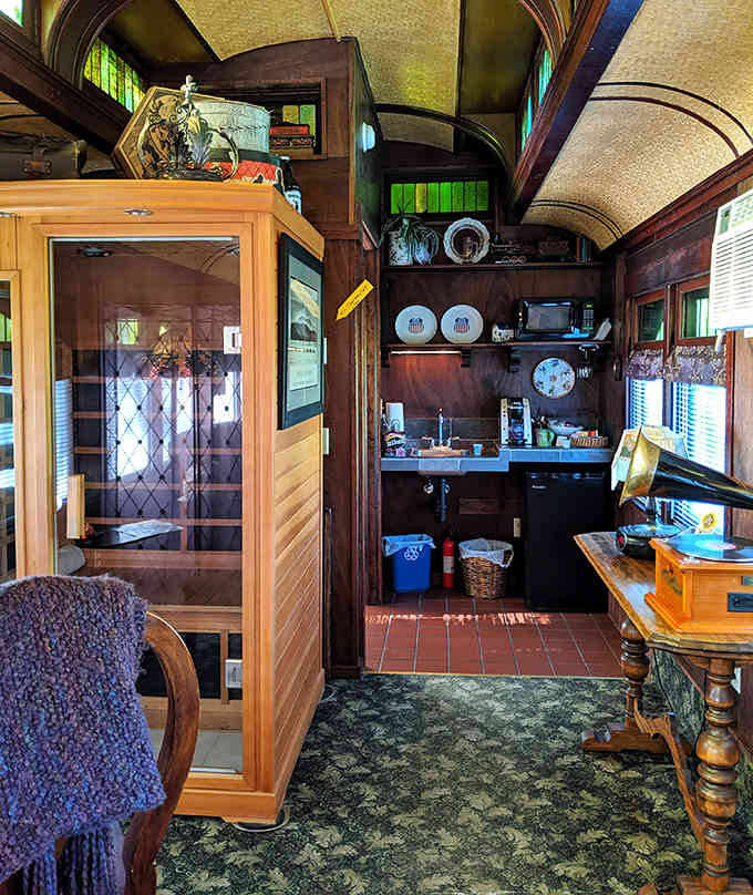 The curved ceiling and rich wood paneling prove that train car living beats any boring rectangular hotel room.