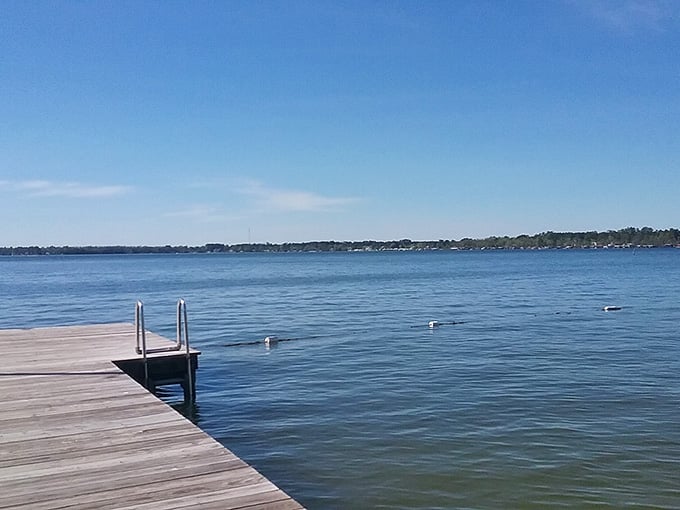 That dock stretching into impossibly clear water is basically an invitation you can't refuse without regret.